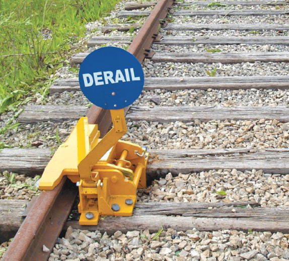 One-Way "Left Throw" Hinged Derail w/Pop-Up Sign Holder | Aldon®