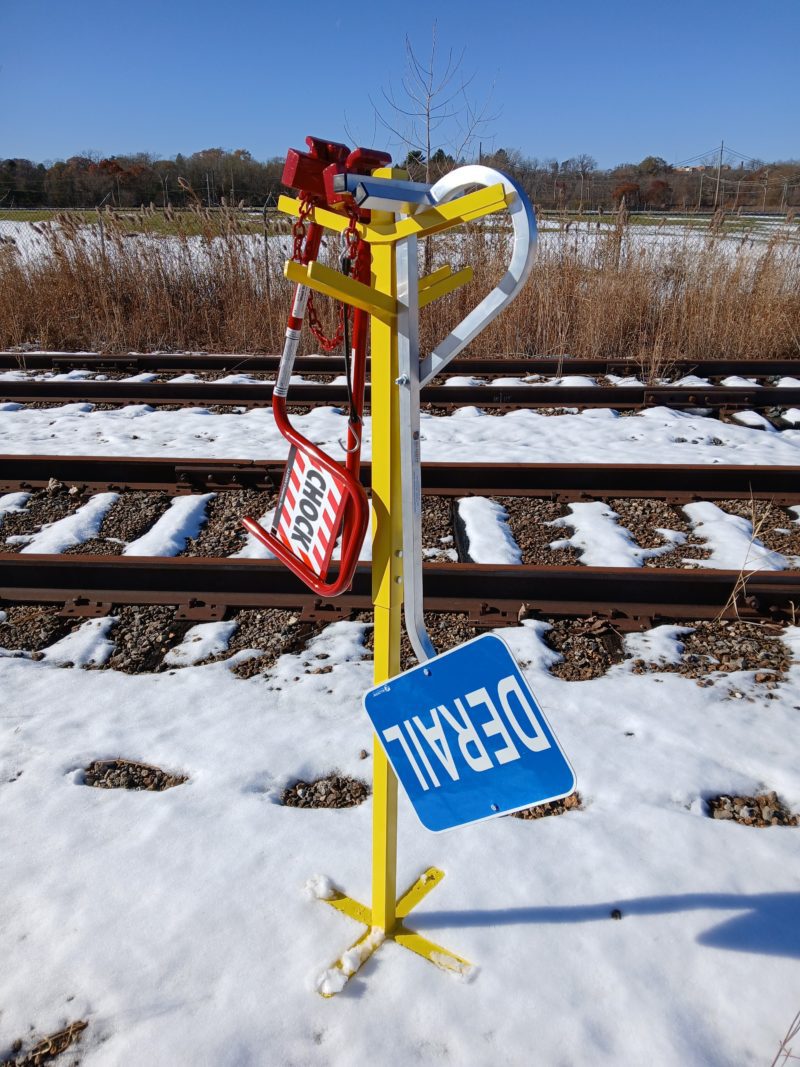 Double Railroad Wheel Chock with Flag (Exposed Rail) | Aldon Company, Inc.